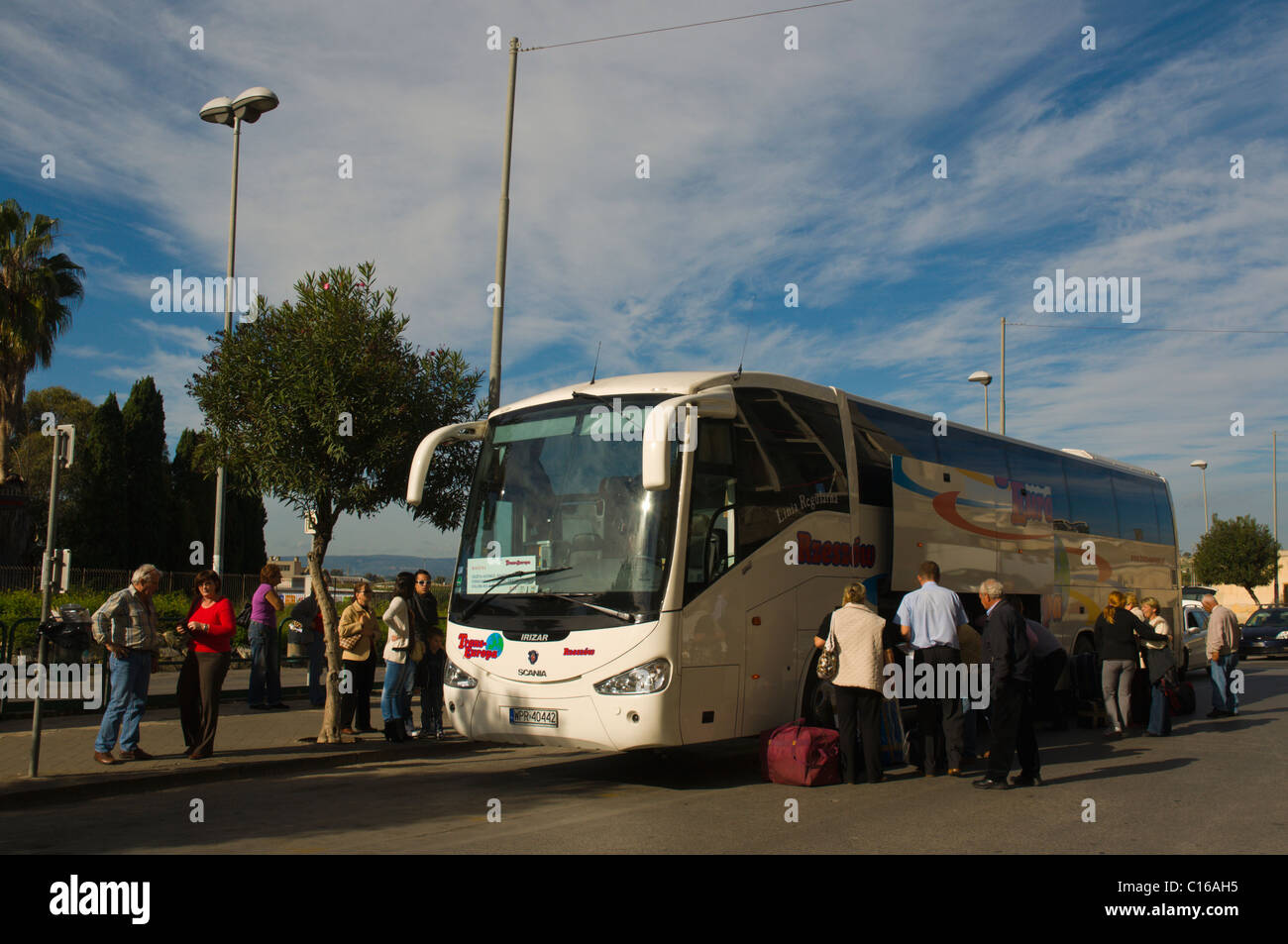 People getting on bus at central bus station Syracuse Sicily Italy ...