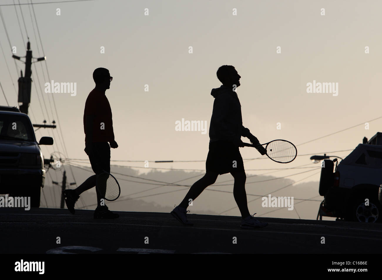 silhouette of two people with tennis rackets Stock Photo - Alamy