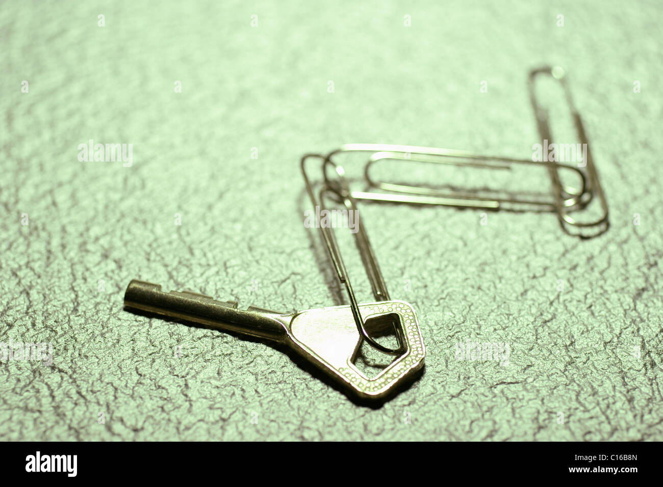 Key with paper clips Stock Photo - Alamy