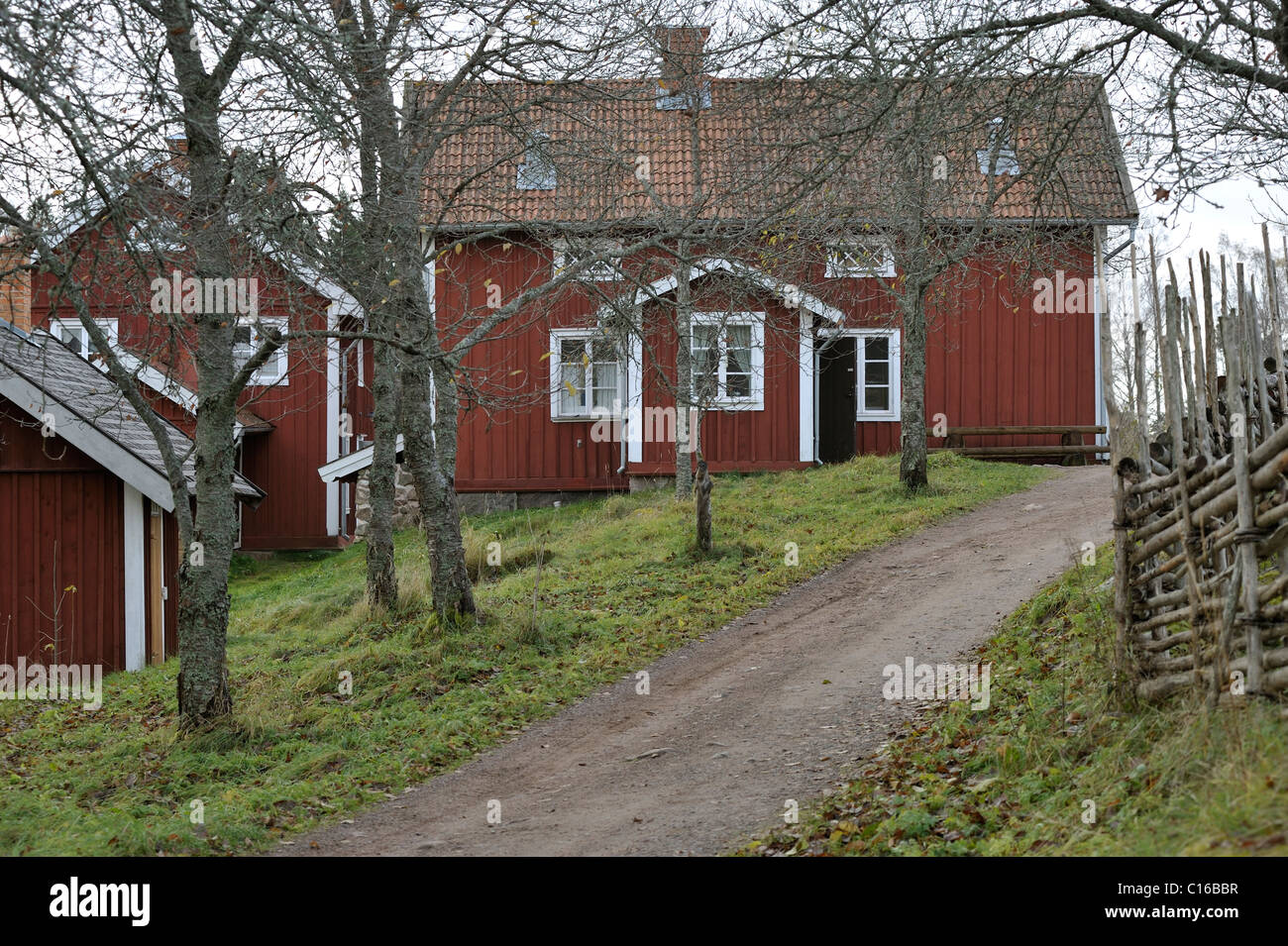 Main wooden building with traditional red paint on old farmstead ...