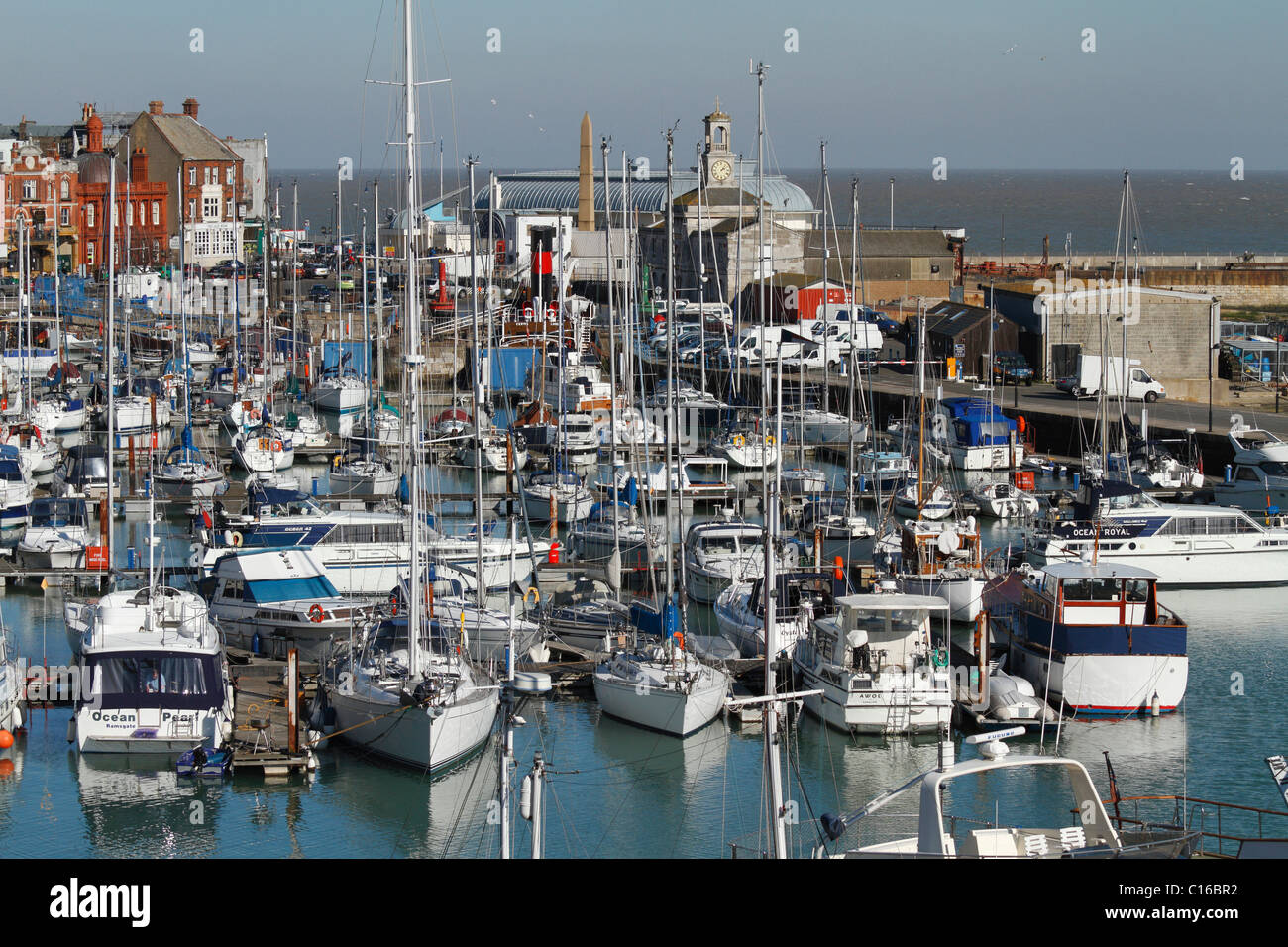 A view of Ramsgate inner harbour showing shops behind and the maritime ...