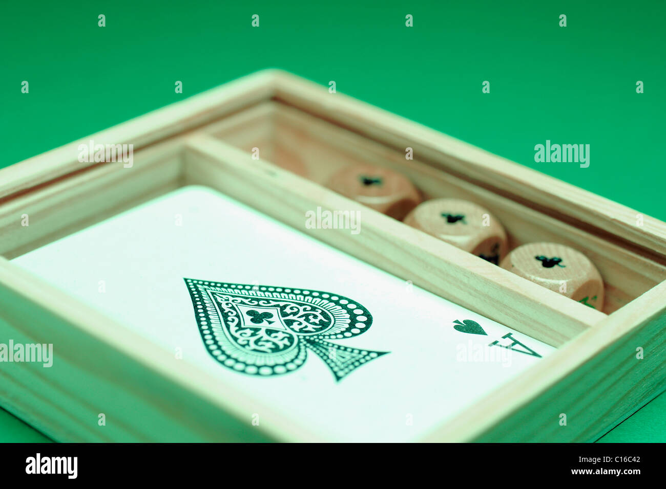 Dice and playing cards in wooden box Stock Photo - Alamy