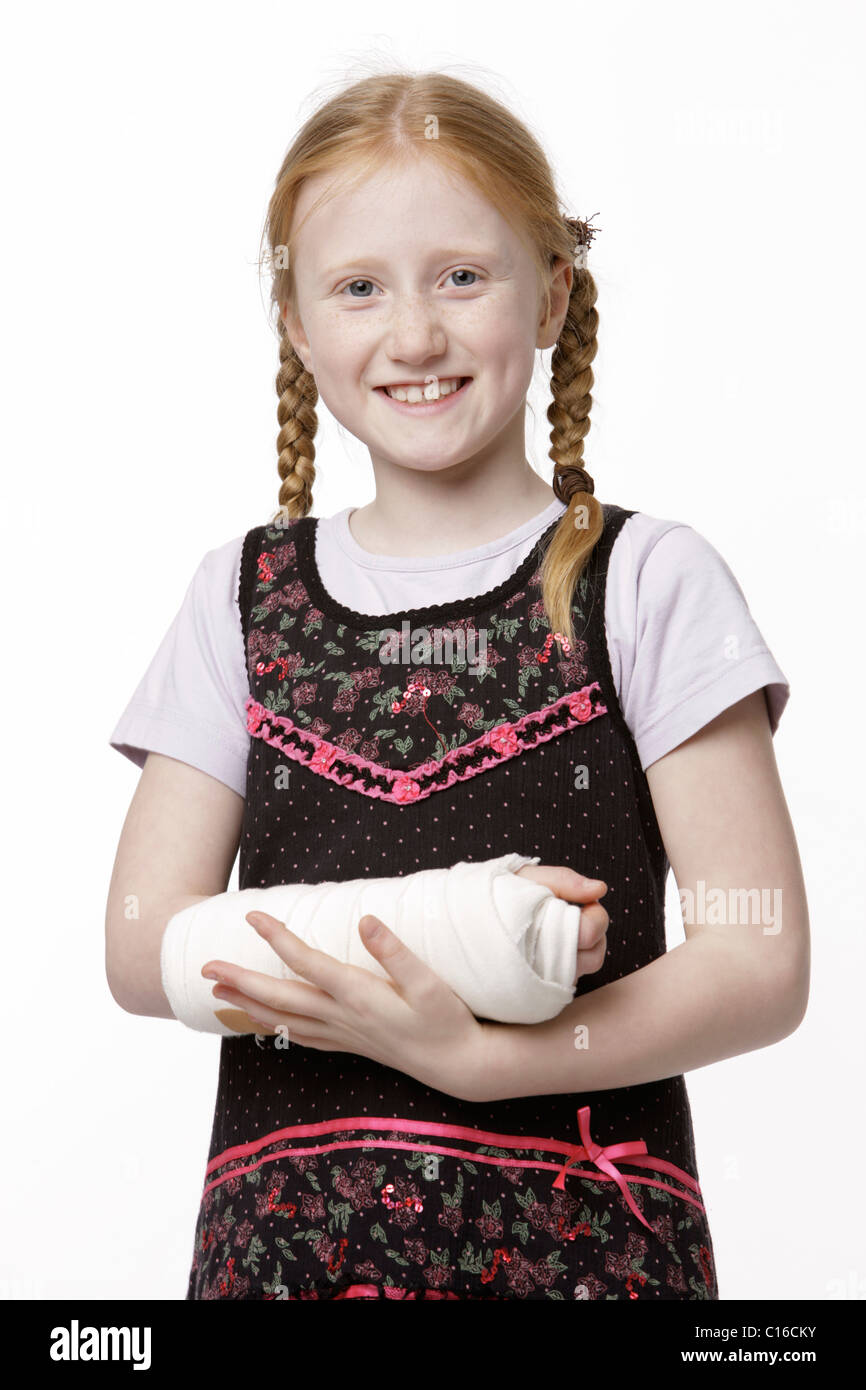 8-year-old girl with her arm in plaster, laughing Stock Photo - Alamy