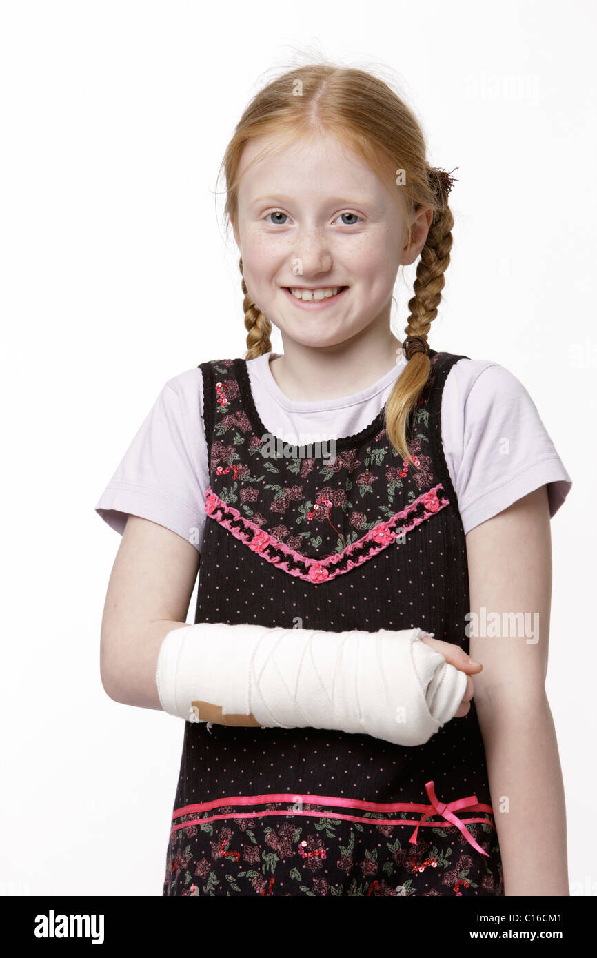 8-year-old girl with her arm in plaster, laughing Stock Photo - Alamy