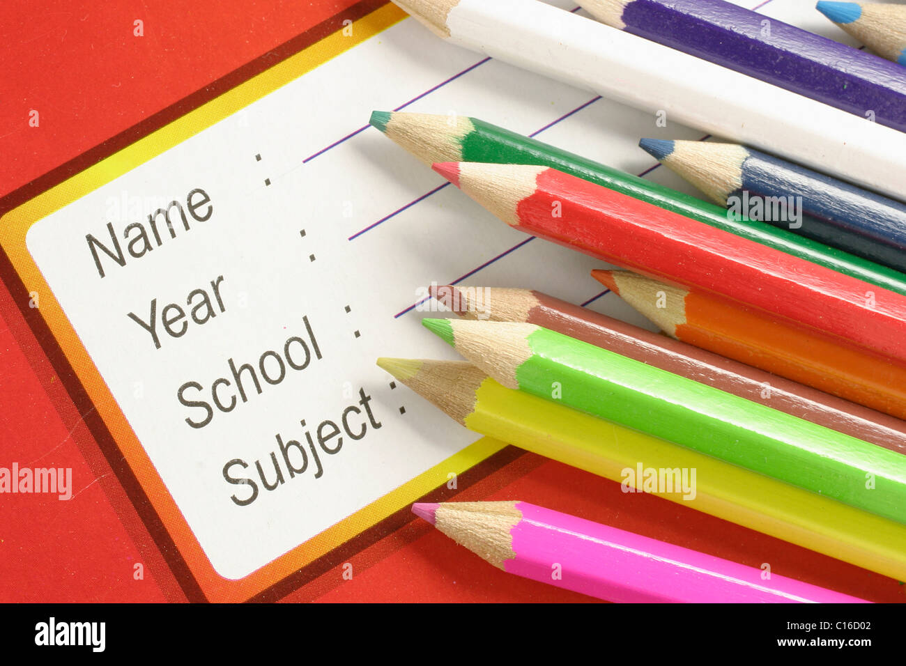 Colour pencils and exercise book Stock Photo - Alamy