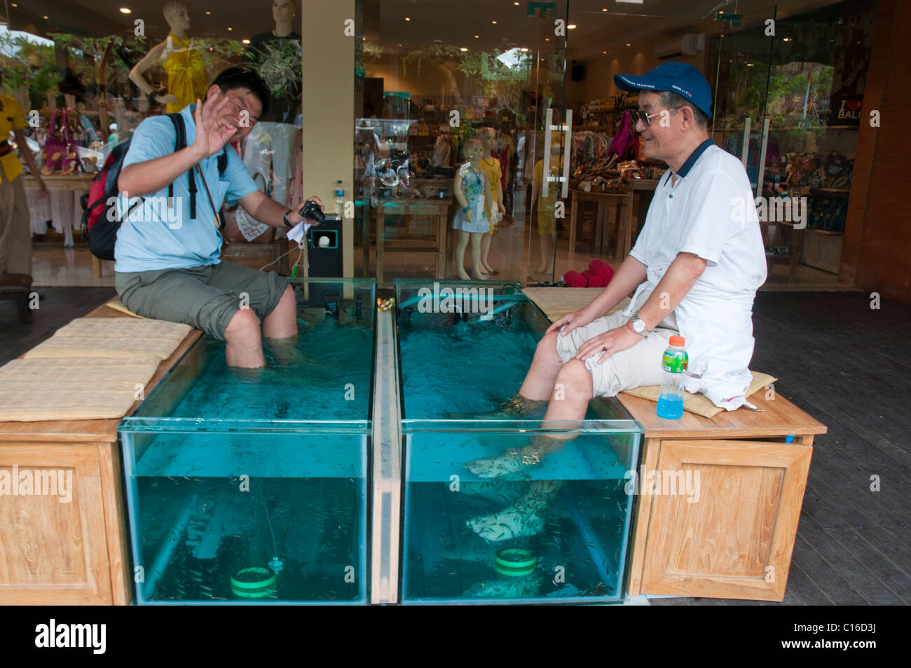 Touritst having a fish foot spa in Ubud Bali Stock Photo - Alamy
