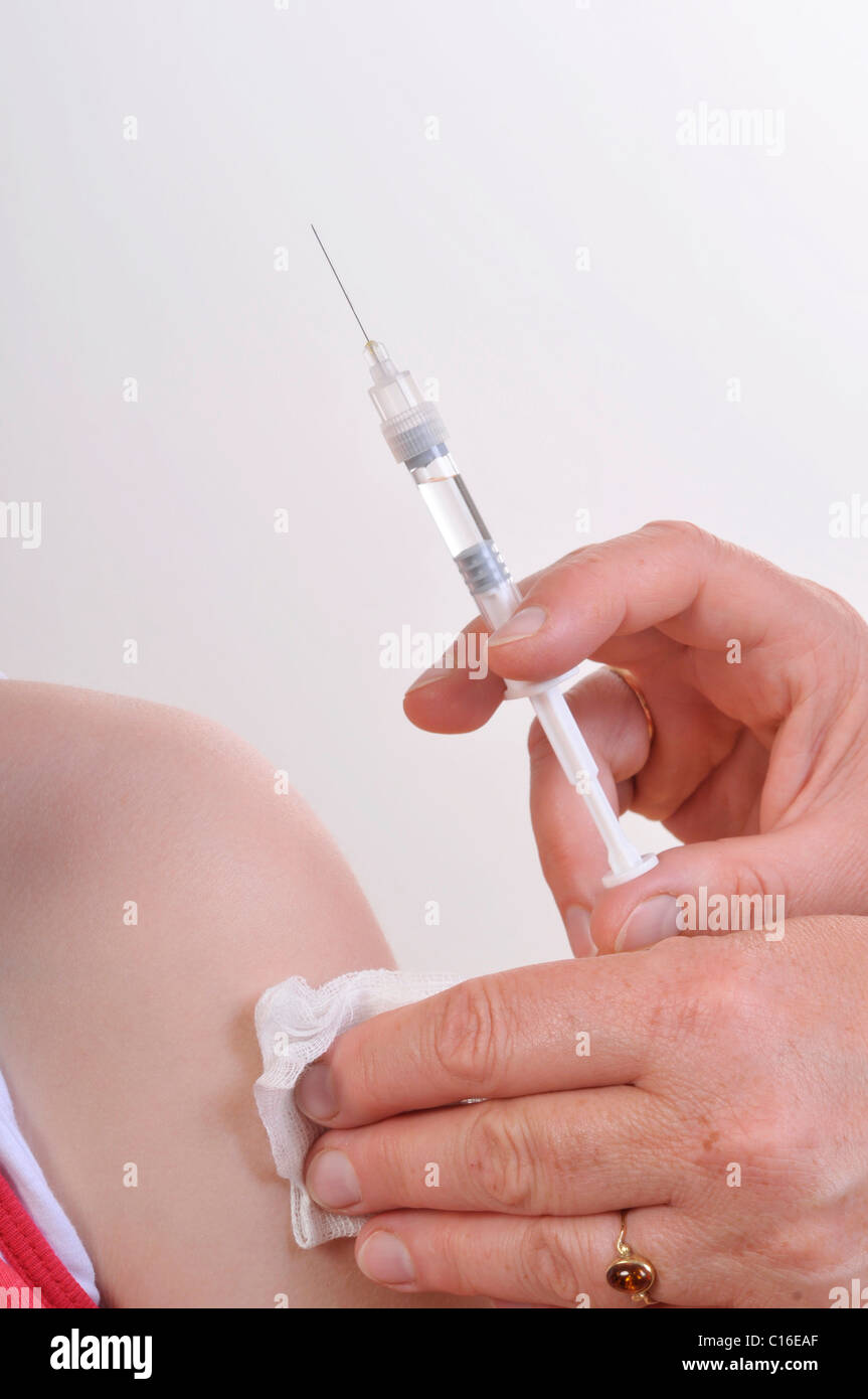 Adolescent getting an injection Stock Photo - Alamy