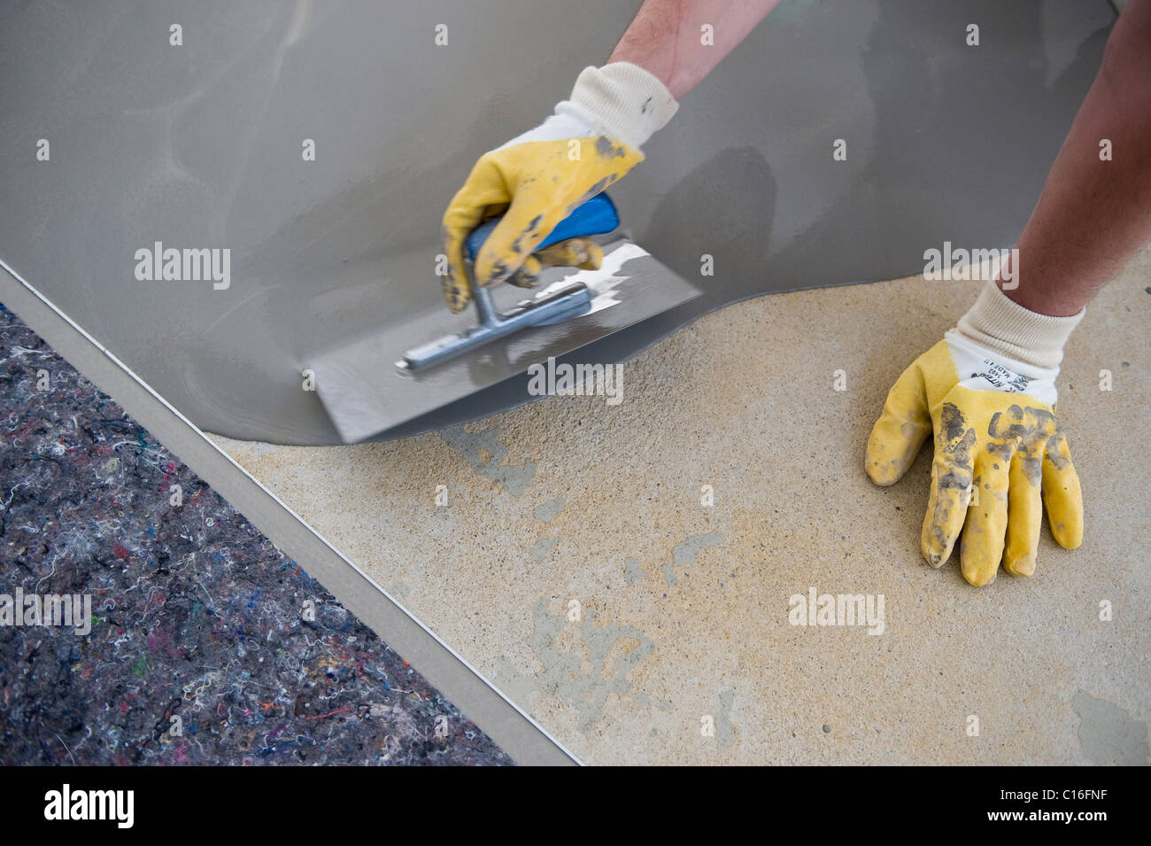 Spreading concrete filler, surface Stock Photo - Alamy