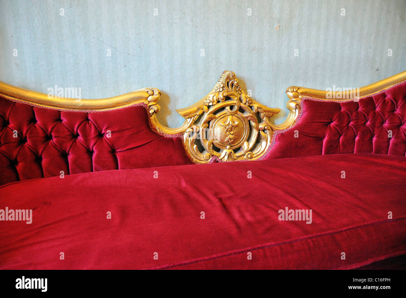 Old, red sofa Stock Photo - Alamy