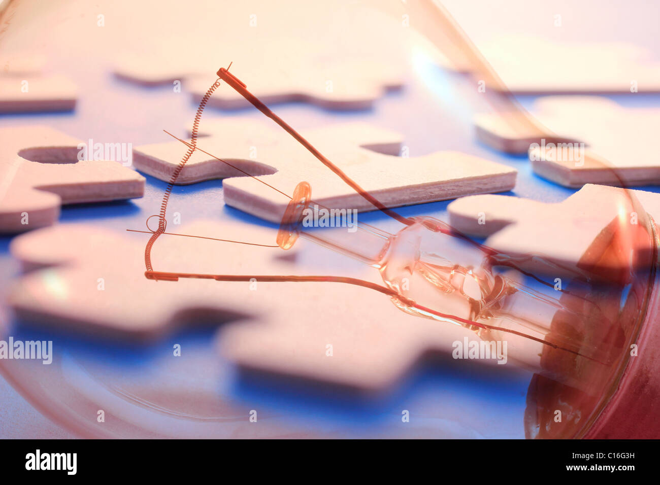 Light bulb with jigsaw puzzle pieces Stock Photo - Alamy