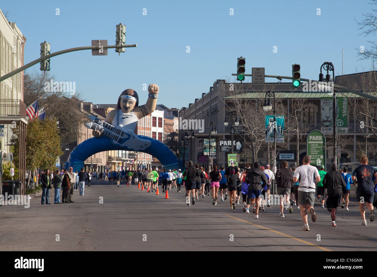 Crowd of racers running toward the giant inflated guitar player on ...