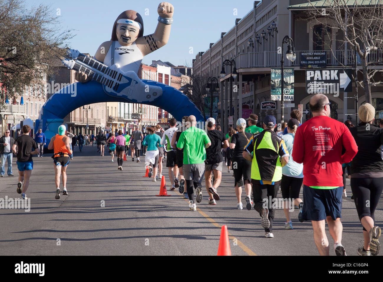 Crowd of racers running toward the giant inflated guitar player on ...