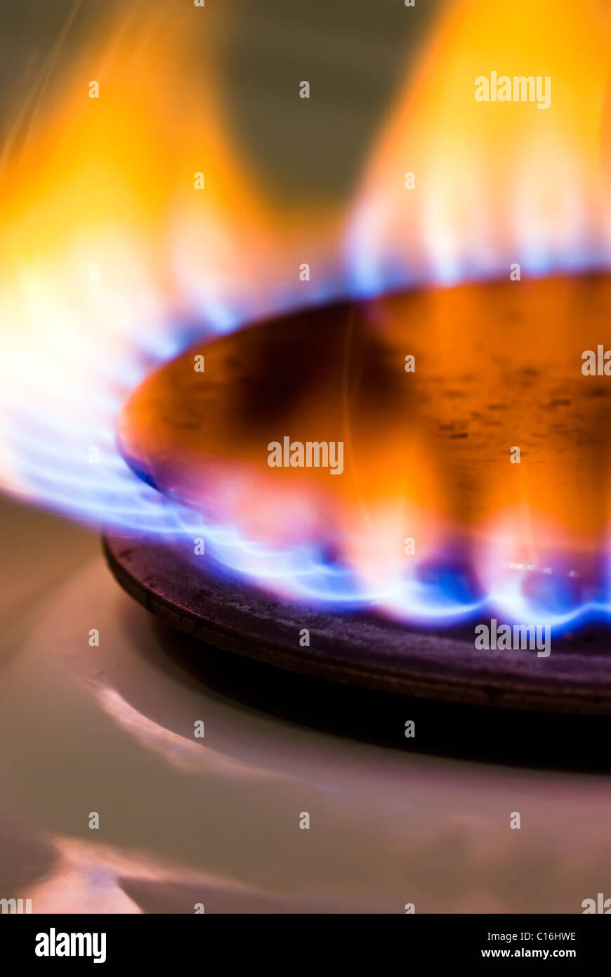 a flame burning on a gas stove in the kitchen Stock Photo - Alamy