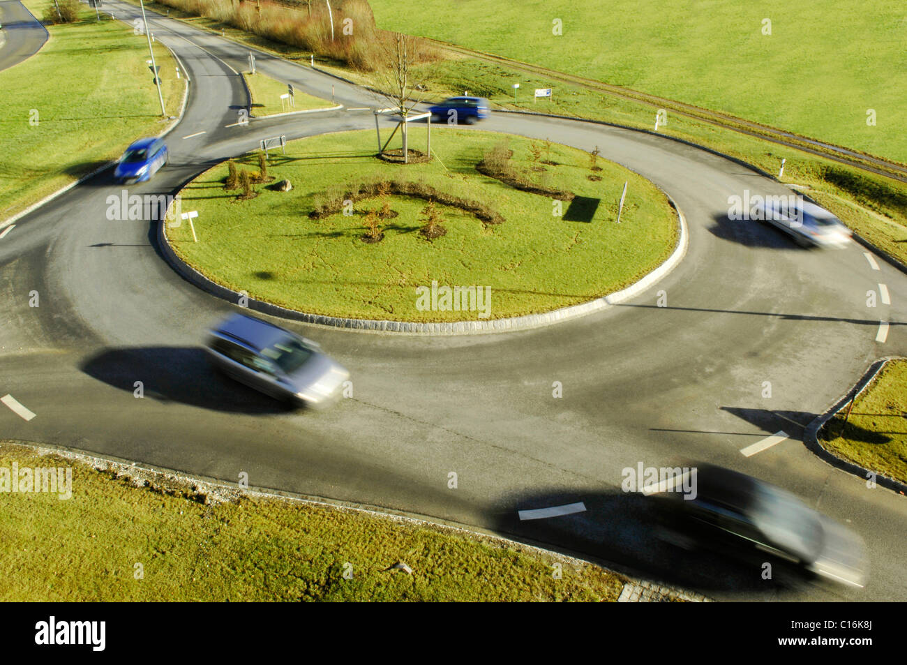 Car driving round roundabout hi-res stock photography and images - Alamy
