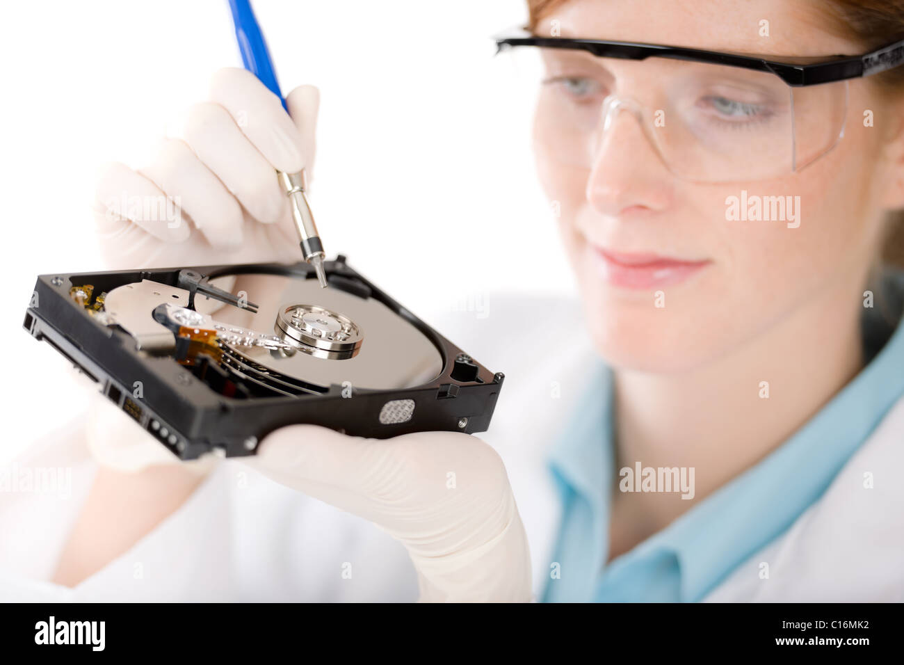 Female computer engineer - IT woman repair hard disc defect Stock Photo ...