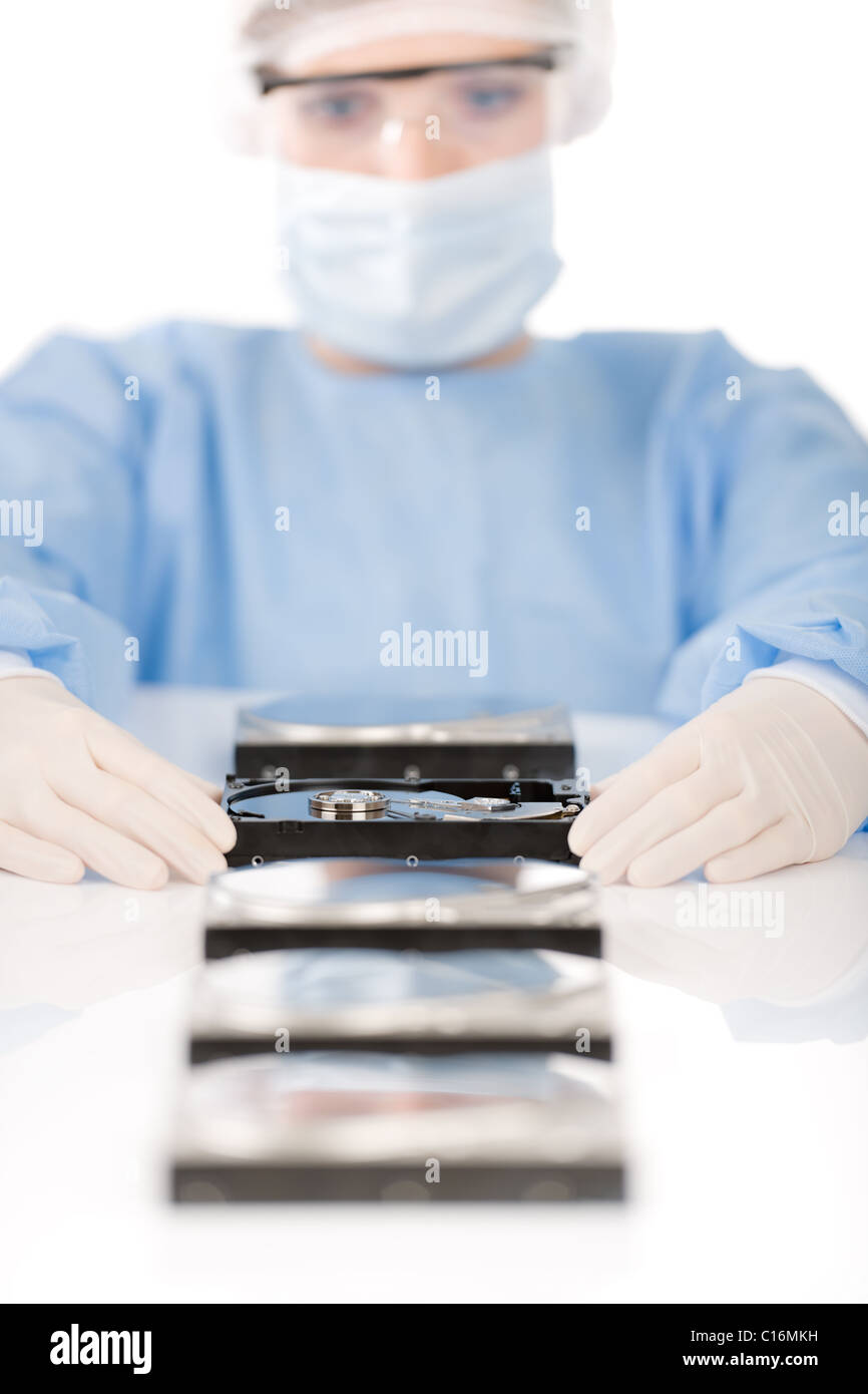 Female computer engineer repair hard disc defect, experiment in sterile ...