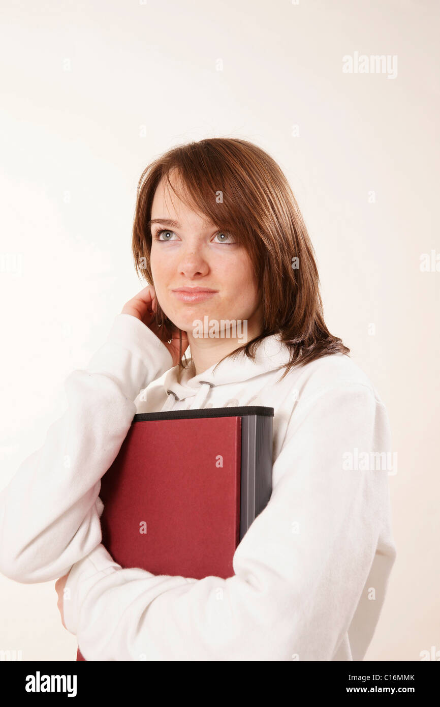 Girl holding documents, application documents, in her hand Stock Photo ...