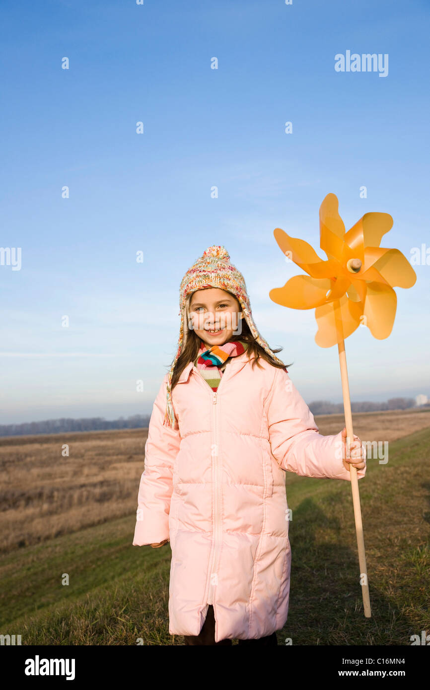 Girl with a pinwheel hi-res stock photography and images - Alamy