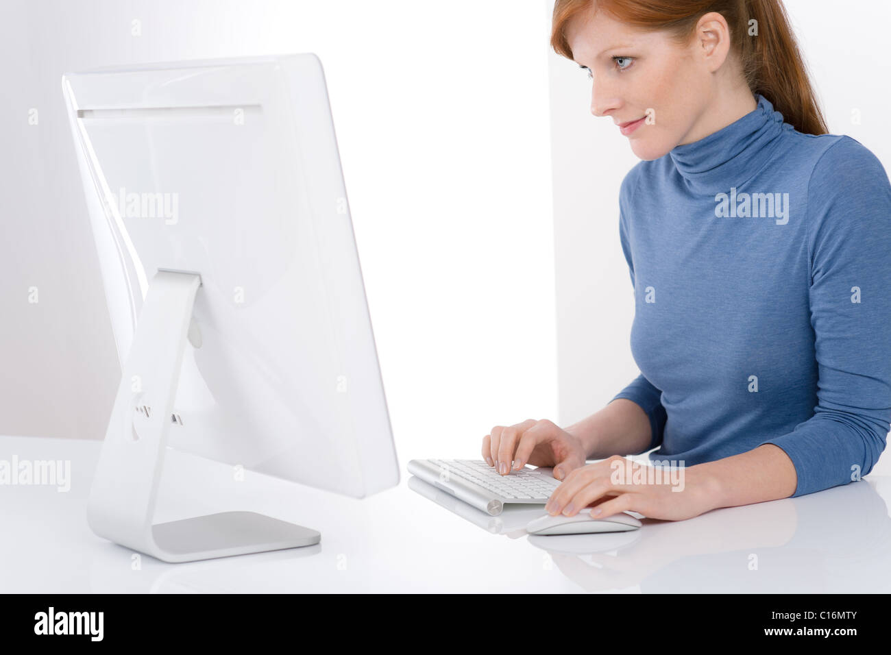 Modern office - young business woman work at computer Stock Photo - Alamy