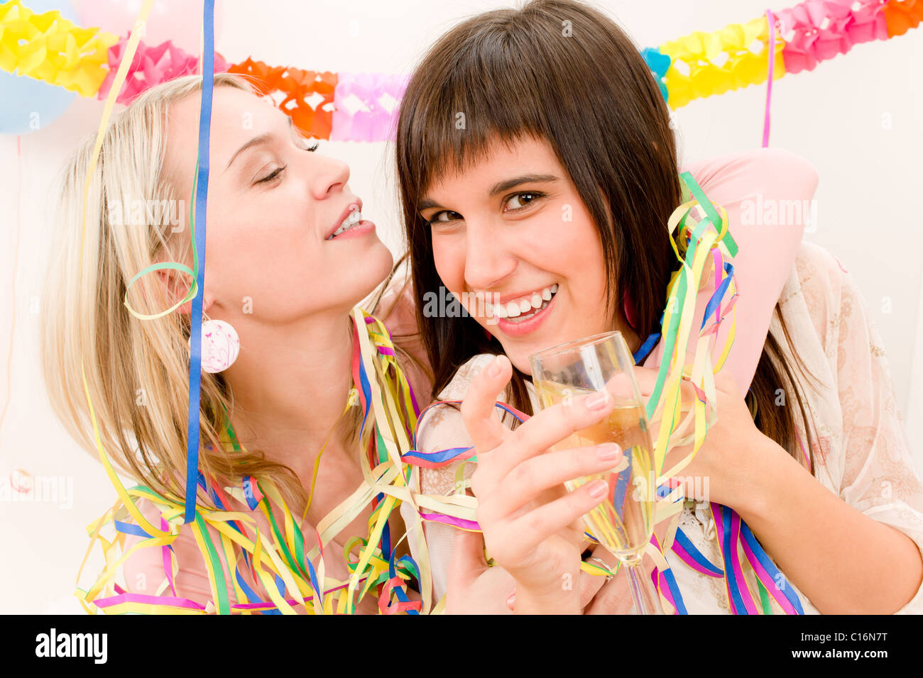 Birthday party celebration - four woman with confetti have fun, toast ...
