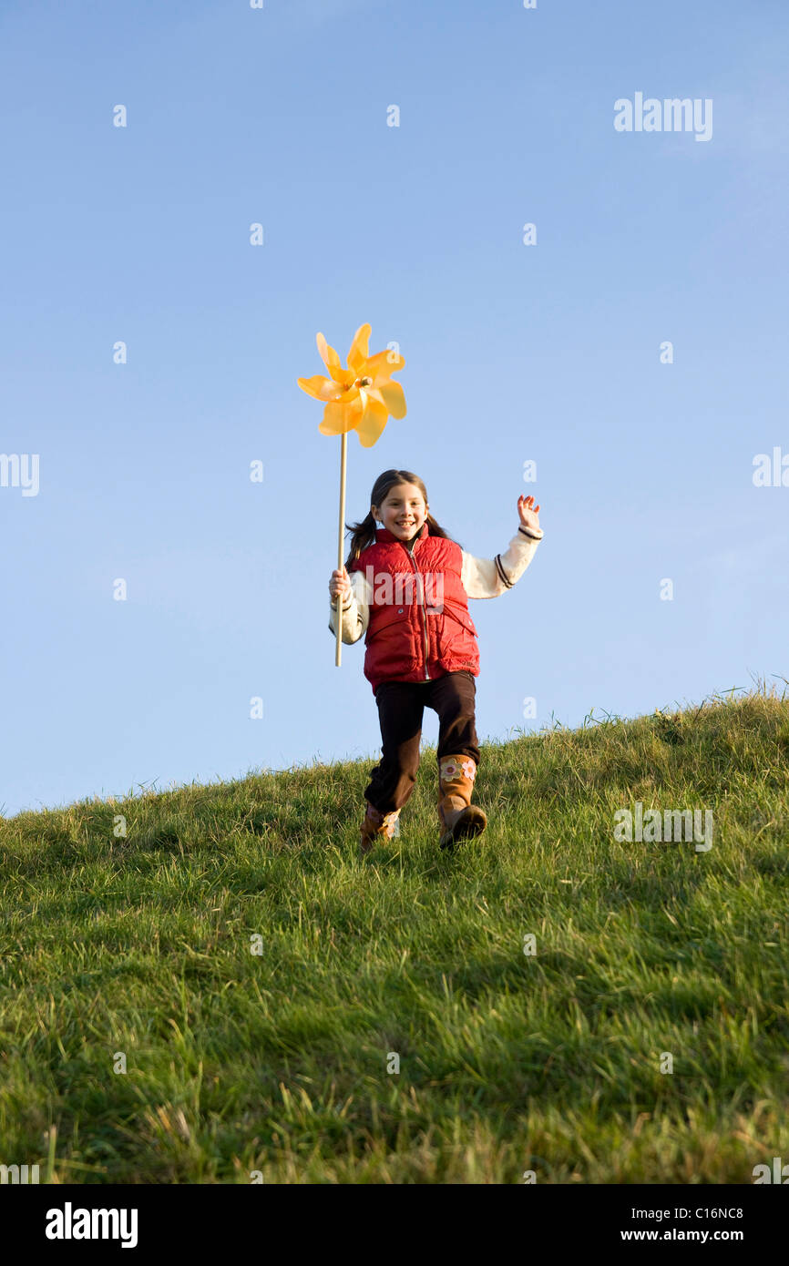 Girl with a pinwheel hi-res stock photography and images - Alamy