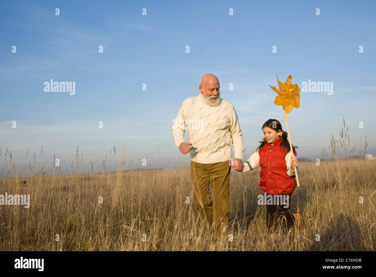 Girl with a pinwheel hi-res stock photography and images - Alamy