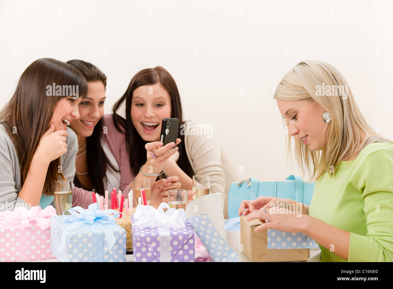 Birthday party - cheerful woman take photo with camera celebrating ...