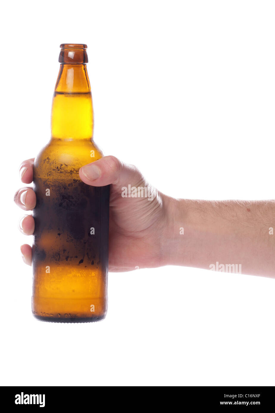 Hand holding beer bottle studio cutout Stock Photo - Alamy