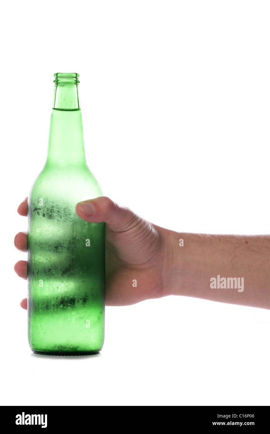 Hand holding beer bottle studio cutout Stock Photo - Alamy