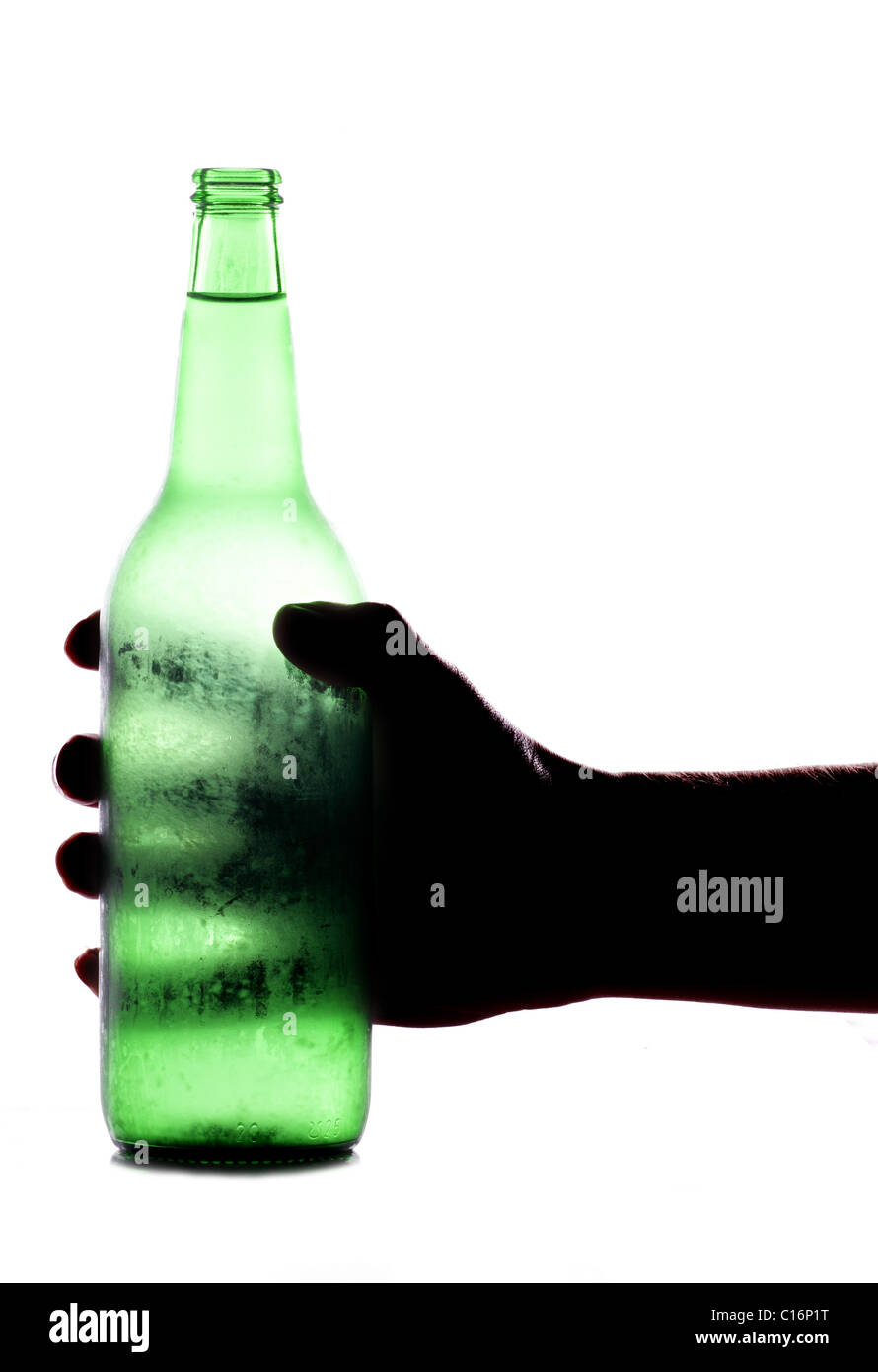 Hand holding beer bottle studio cutout Stock Photo - Alamy