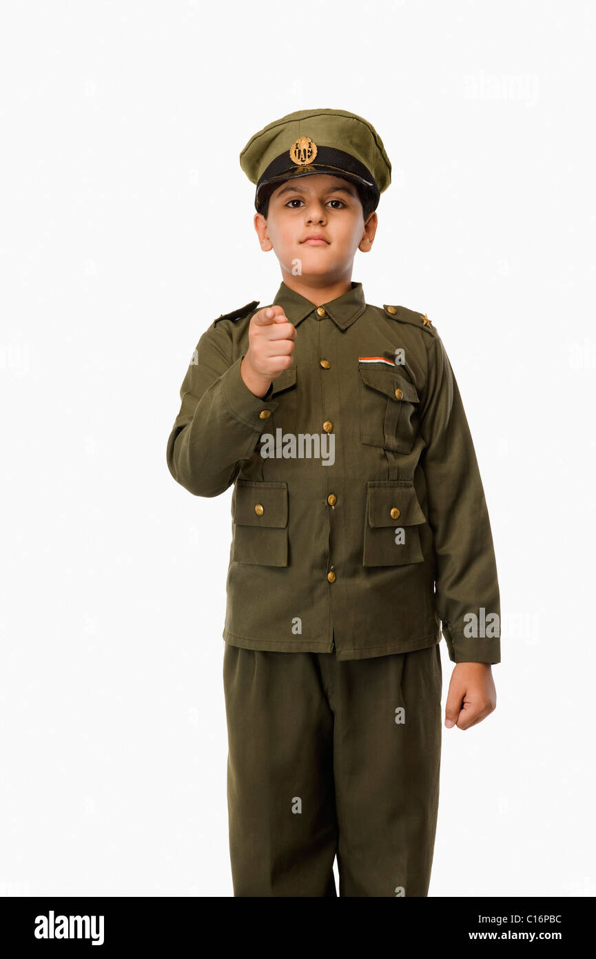 Portrait of a boy pointing in police uniform Stock Photo - Alamy