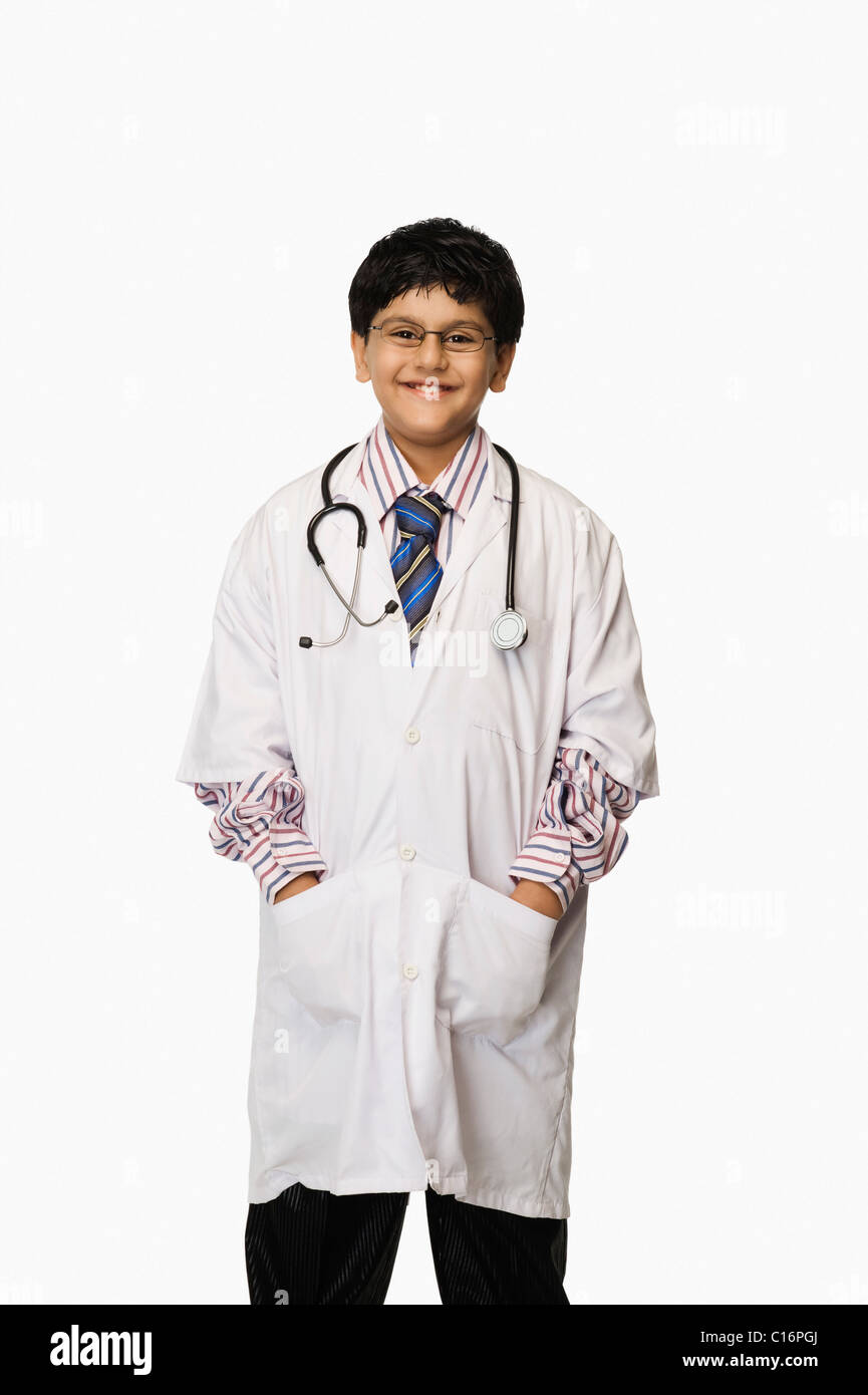 Boy smiling in a lab coat Stock Photo - Alamy