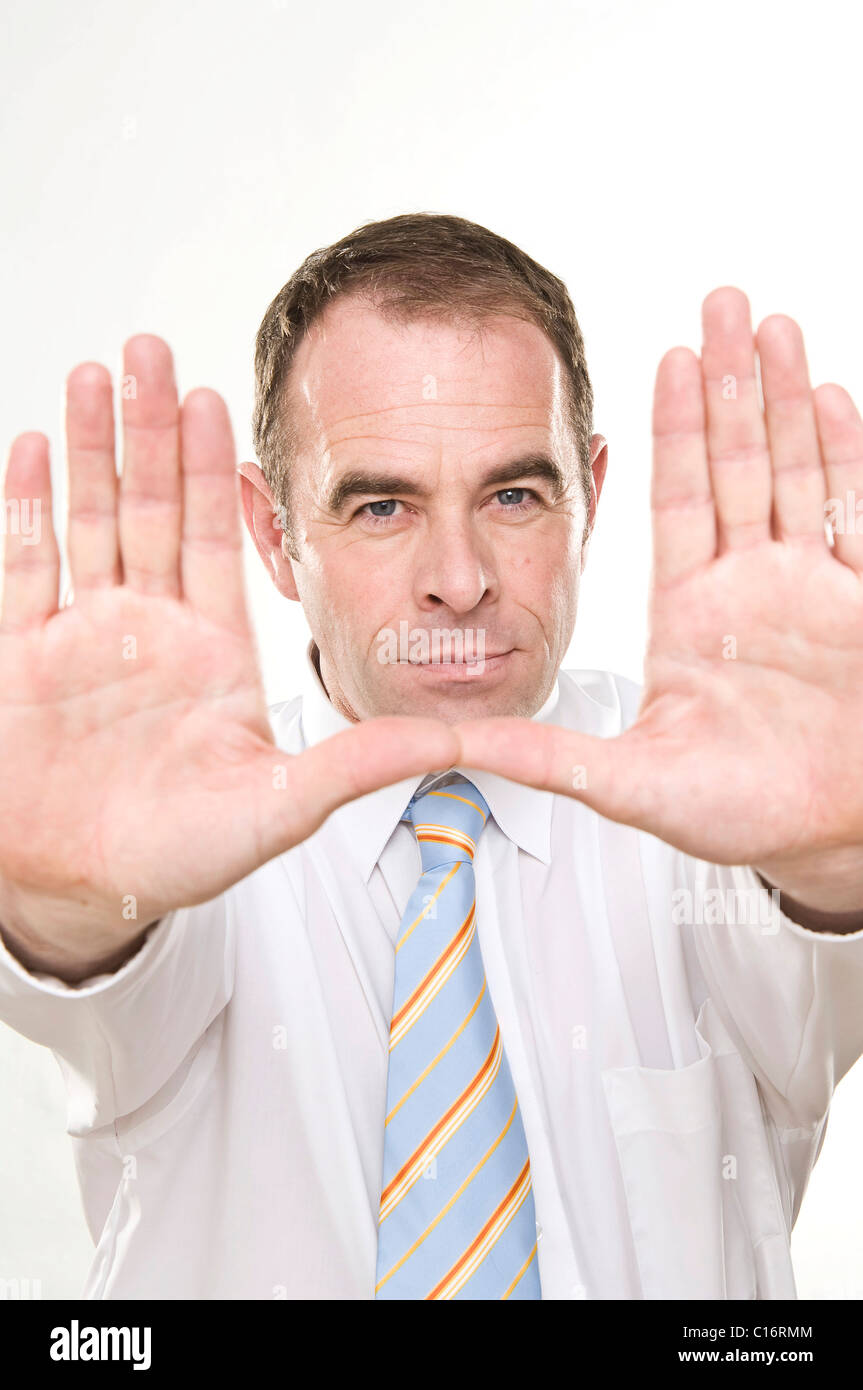 Businessman with both palms of hands held forward Stock Photo - Alamy