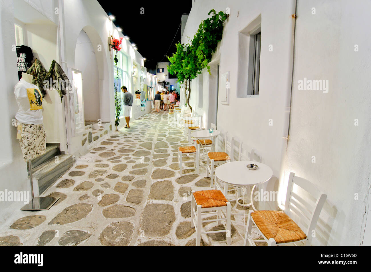 Greek chairs and tables standing on mosaic-like painted paving stones ...