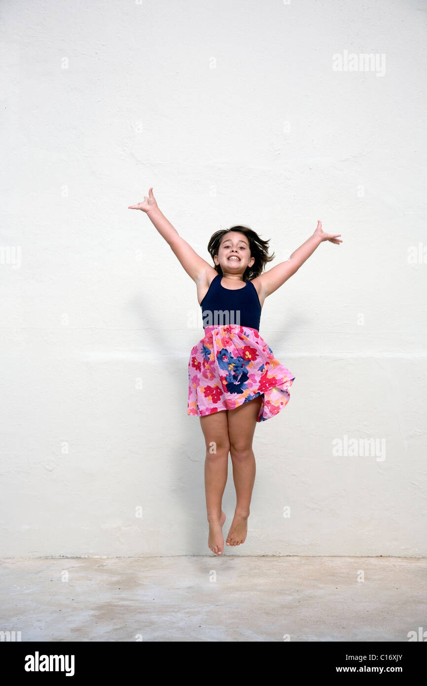 Girl jumping with dress on Stock Photo - Alamy