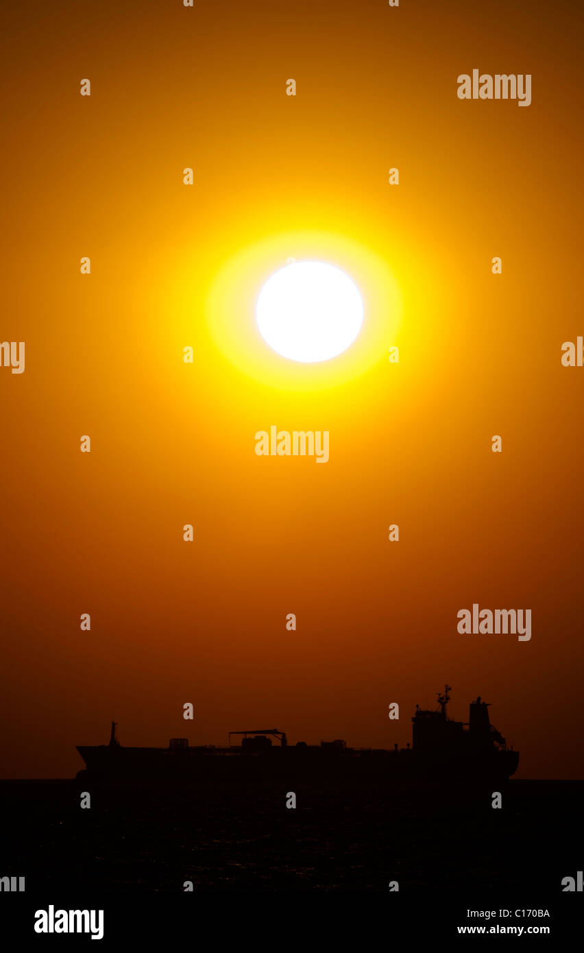 Solar power or oil? Oil tanker at sunset, near Galveston, Texas in the ...