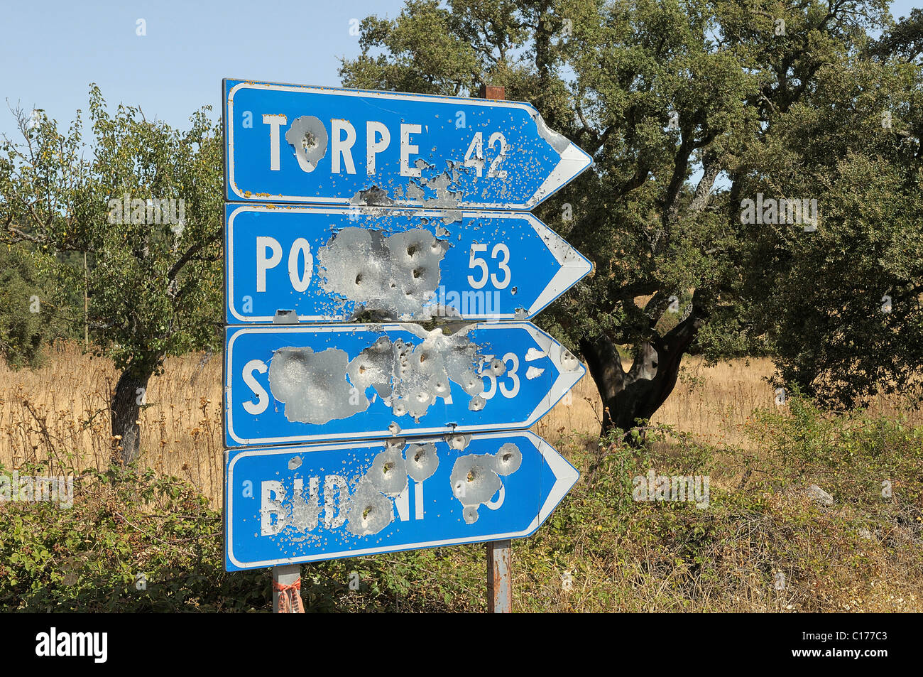 Blue traffic signs full of bullet holes, Sardinia, Italy, Europe Stock ...