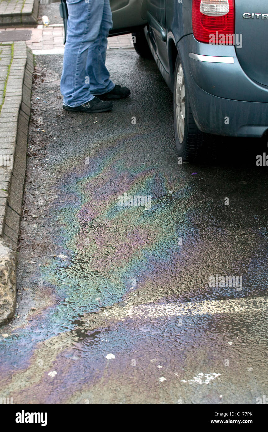Petrol spilt from car in supermarket carpark causing pollution Stock ...
