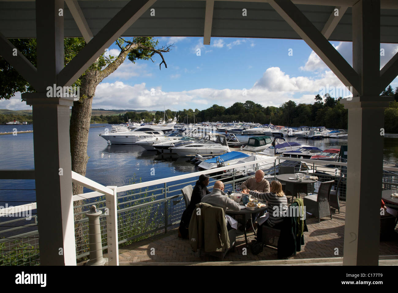 Eating lunch "al fresco" on the terrace of a restaurant by a marina ...