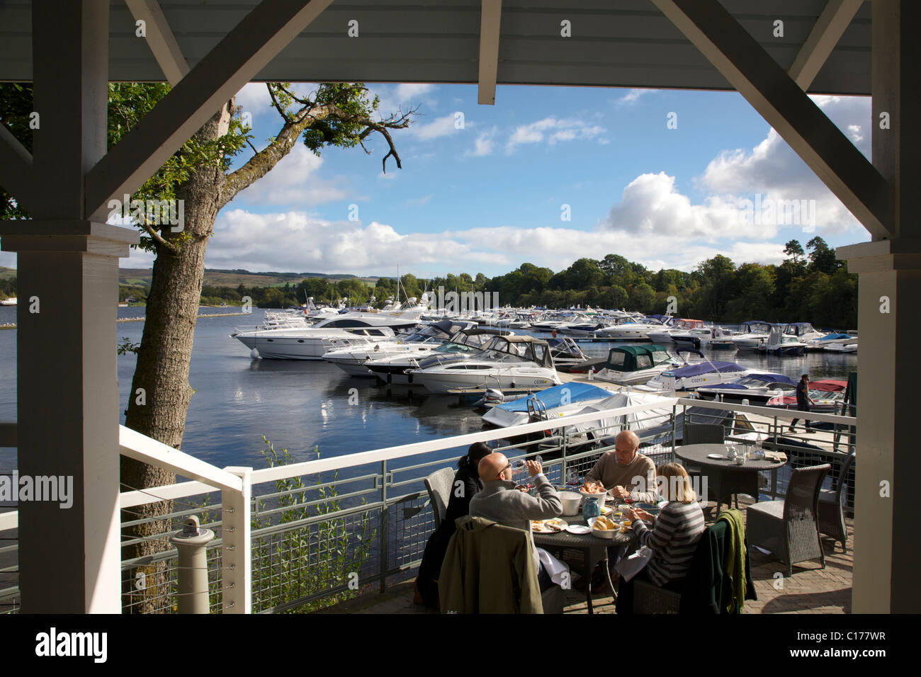 Eating lunch "al fresco" on the terrace of a restaurant by a marina ...