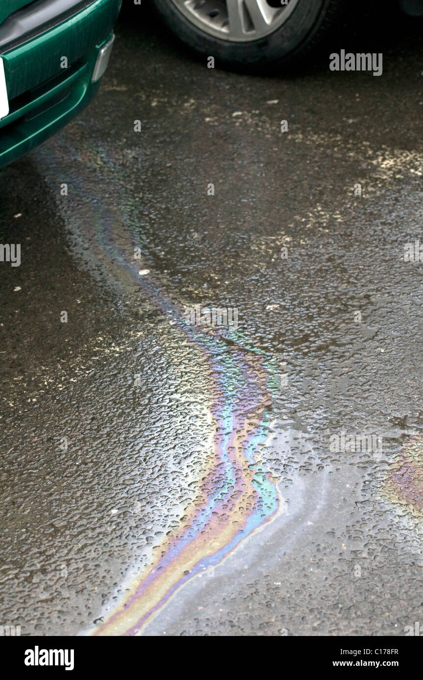 Petrol spilt from car in supermarket carpark causing pollution Stock ...