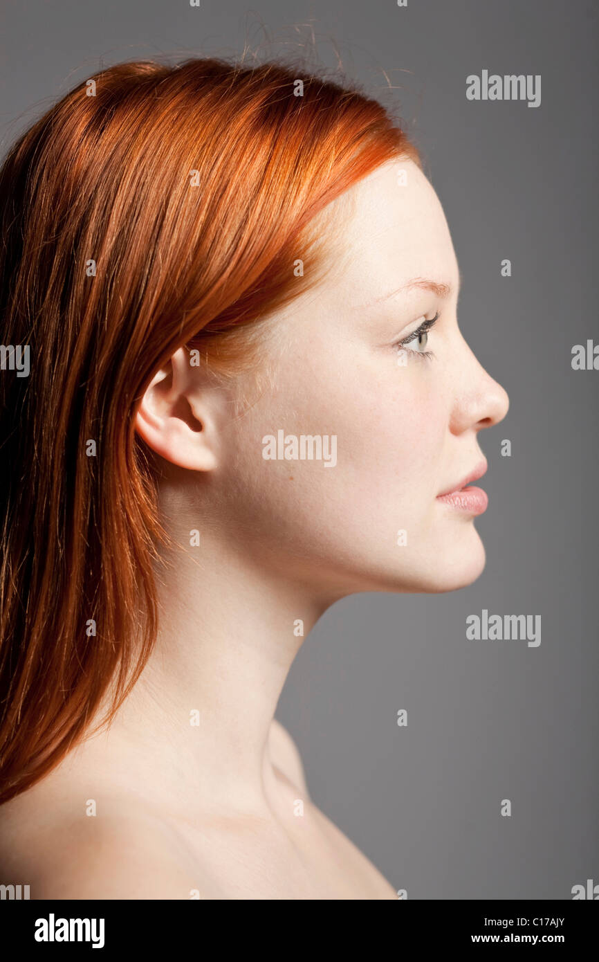 Profile of a young red-haired woman Stock Photo - Alamy