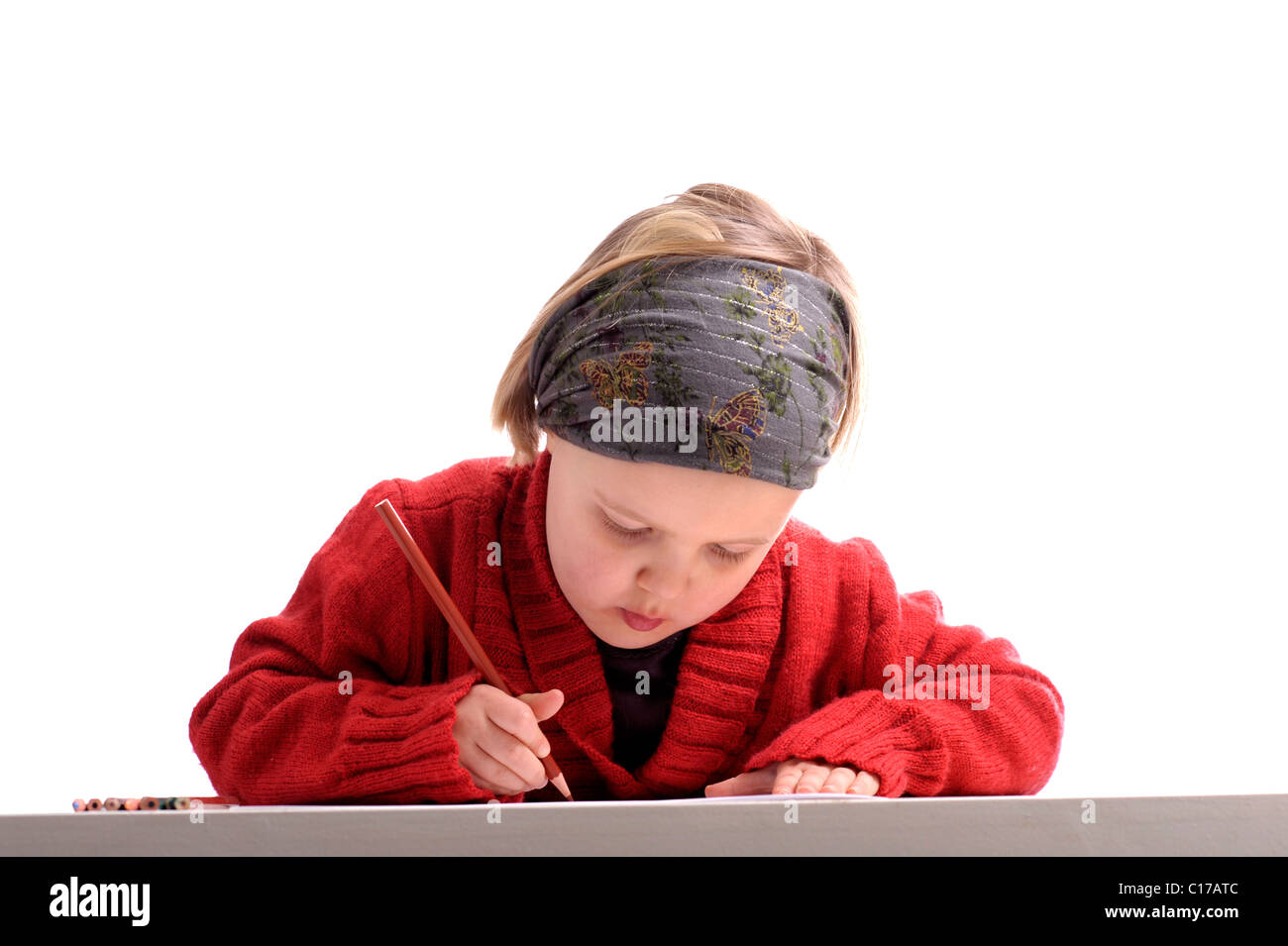 little girl in red drawing with pencils on white background Stock Photo ...