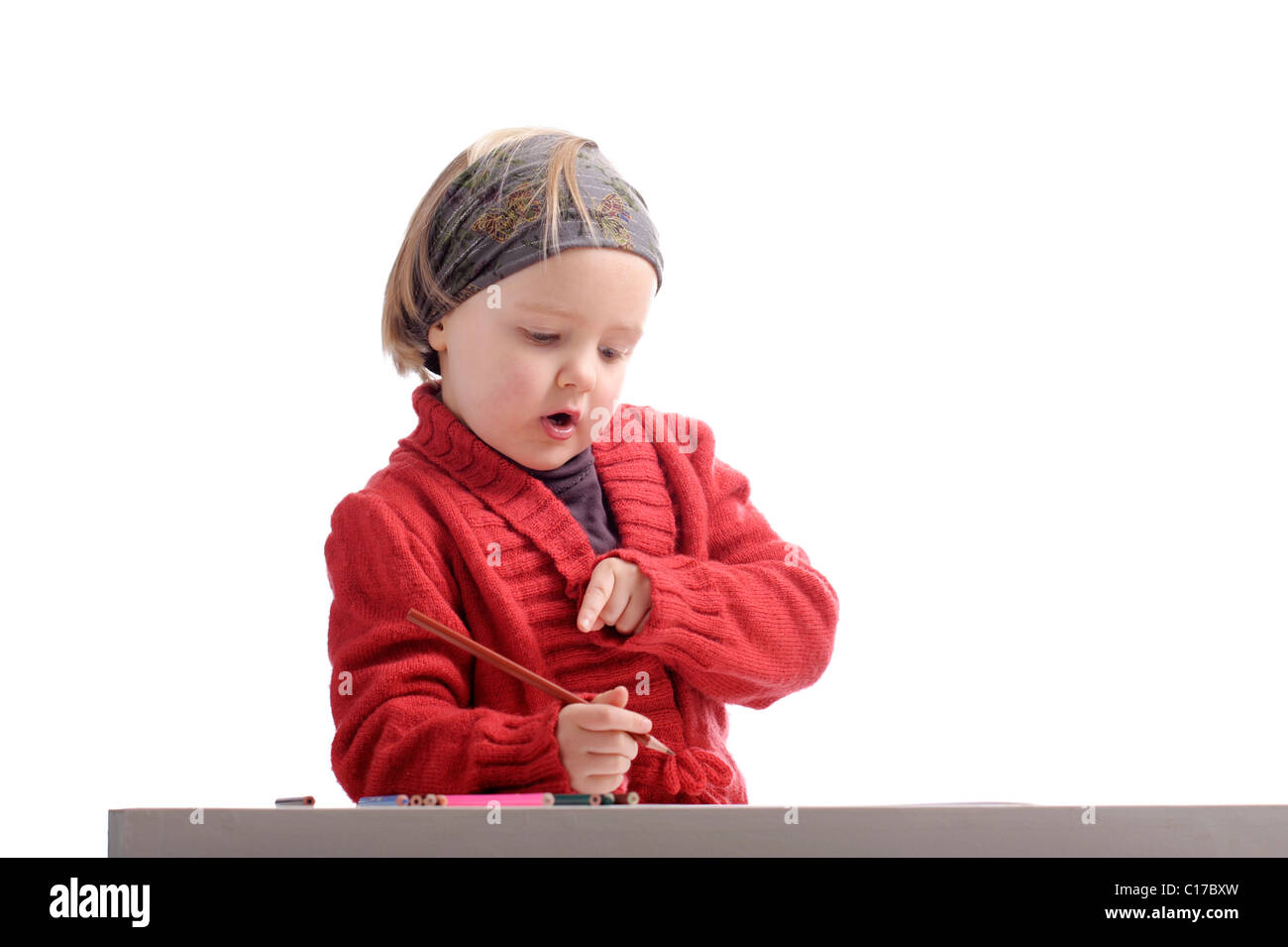 little girl with pencils explaining her drawing. Isolated on white ...