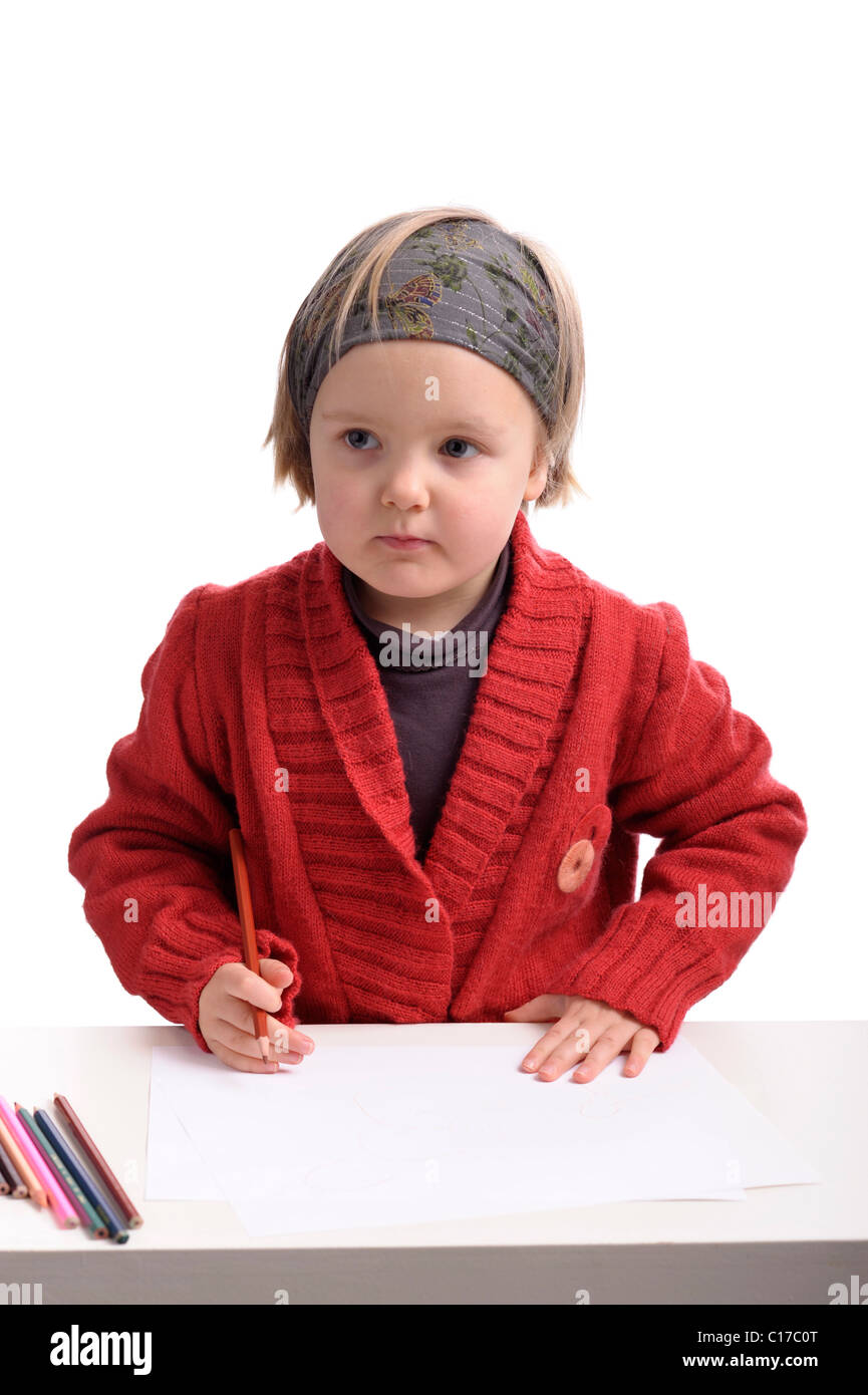 little girl in red drawing with pencils on white background Stock Photo ...