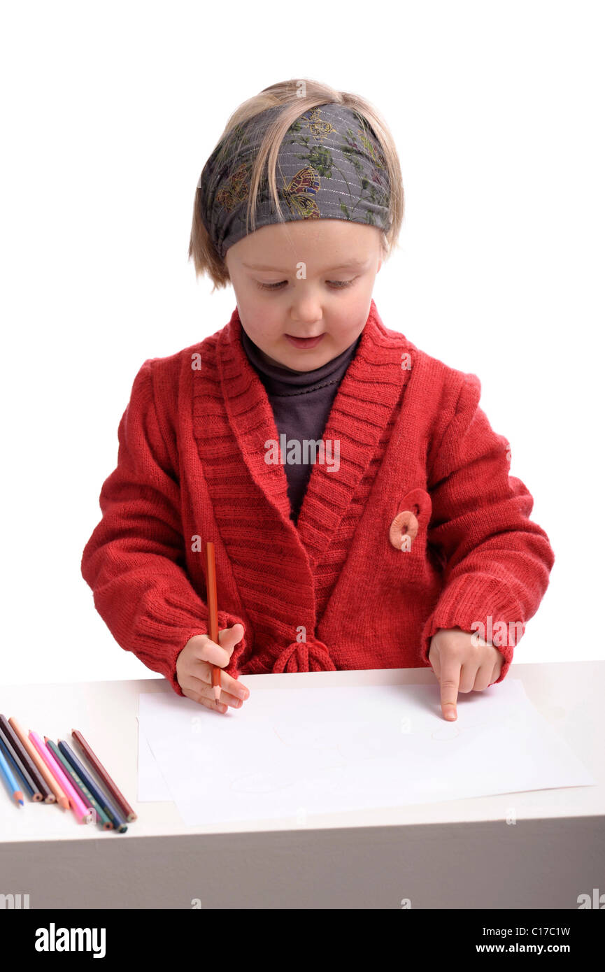 little girl in red drawing with pencils on white background Stock Photo ...