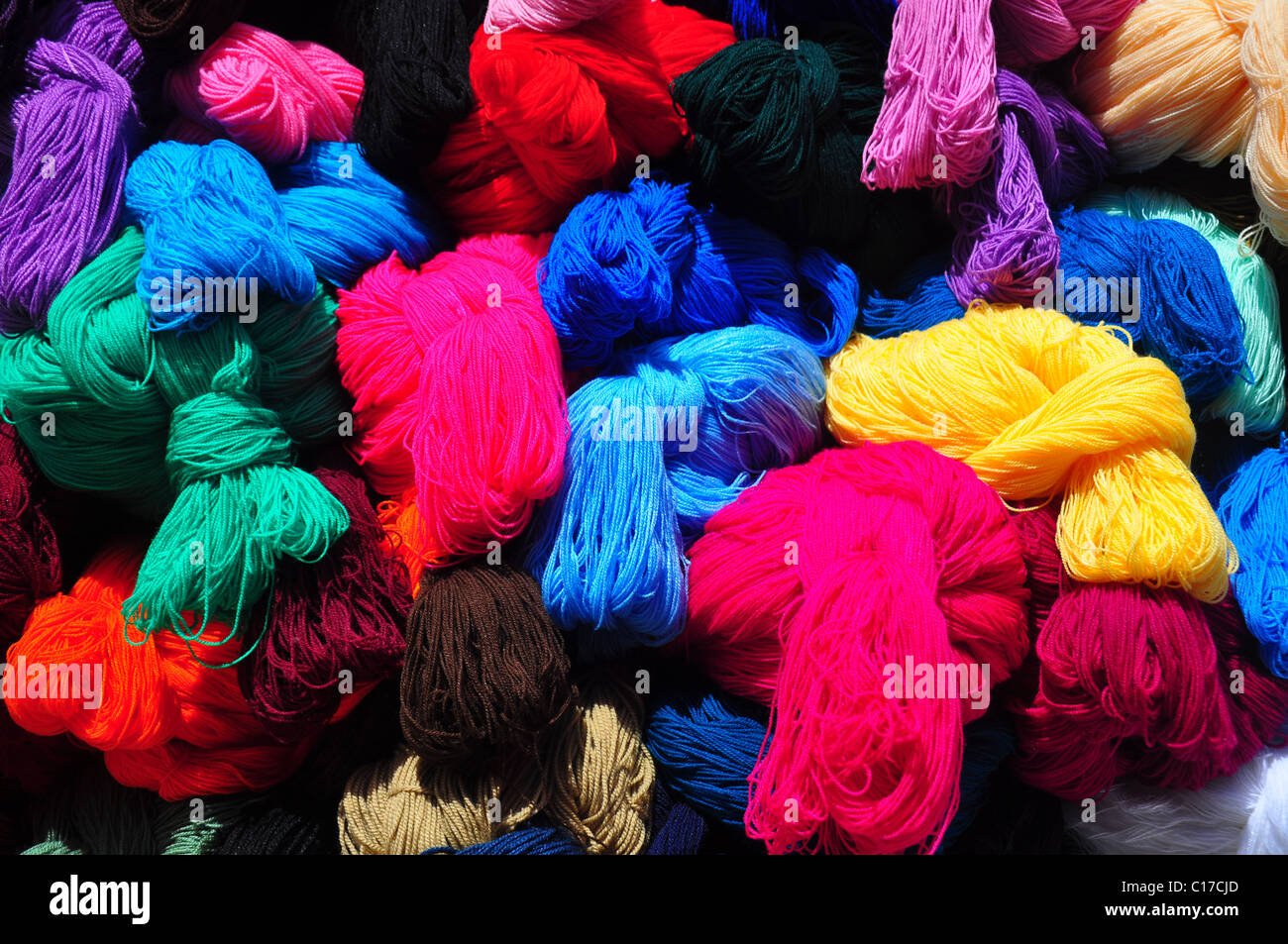 Collection of brightly coloured balls of wool on traditional market ...