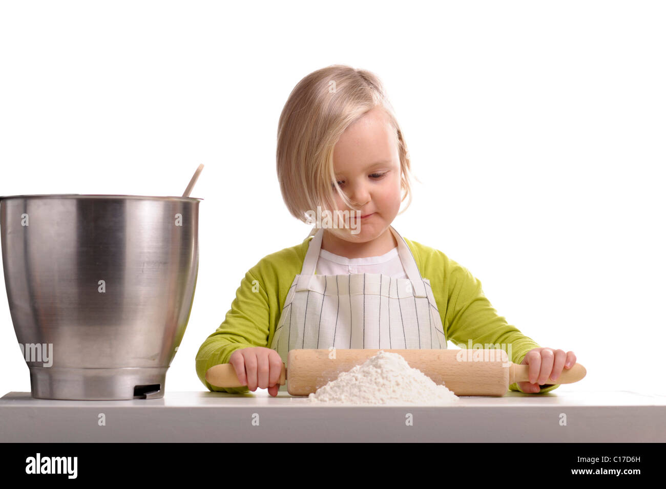 little girl rolling flour with a rolling pin. Isolated on white Stock ...