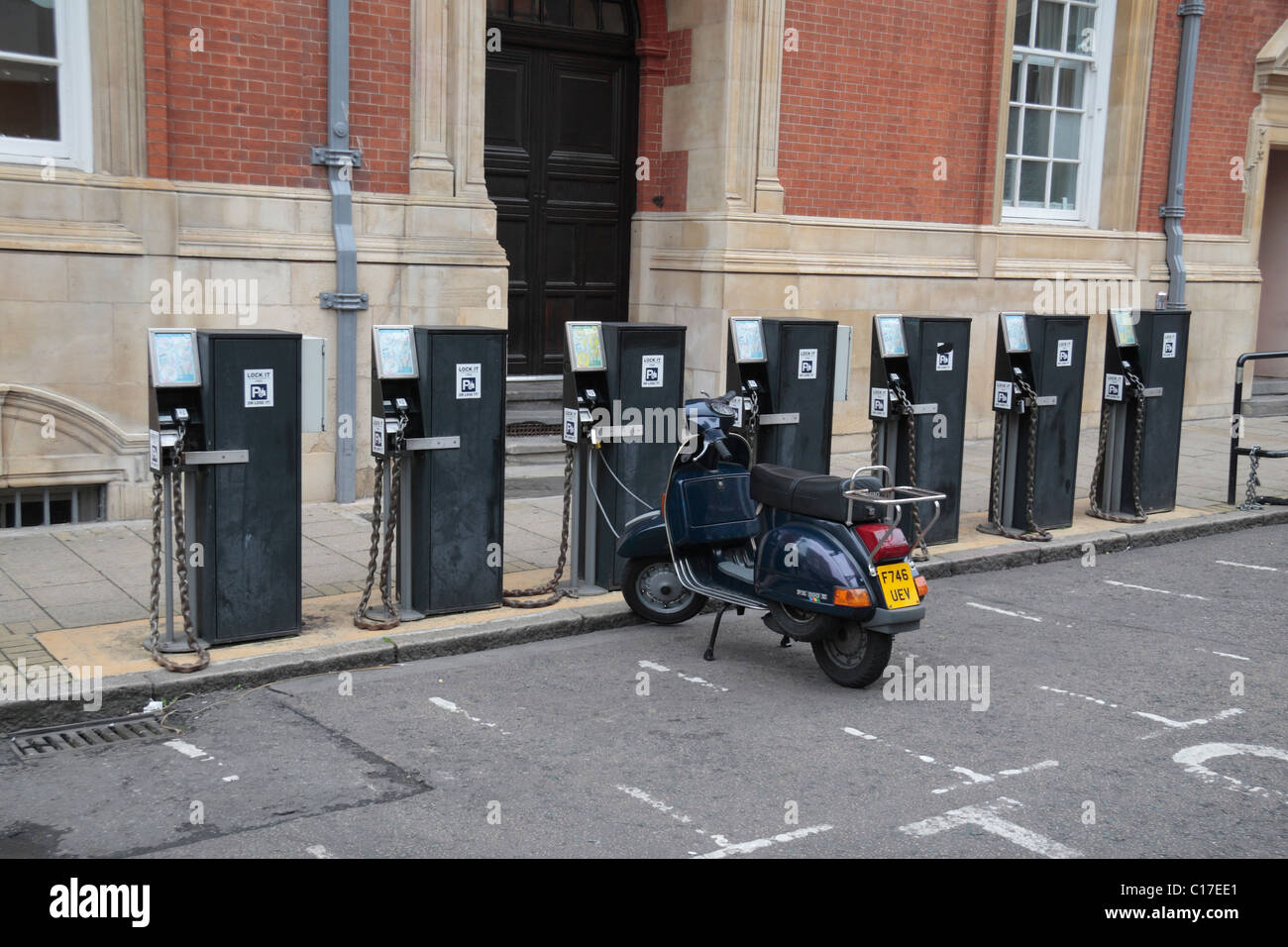 A motorbike parking area with parking machines/meters close to the town ...