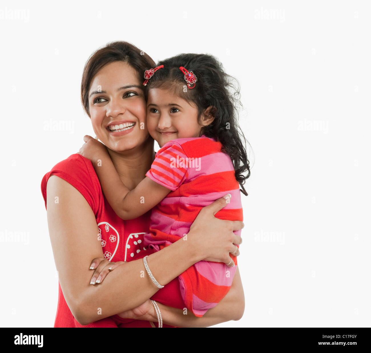 Close-up of a woman hugging her daughter Stock Photo - Alamy